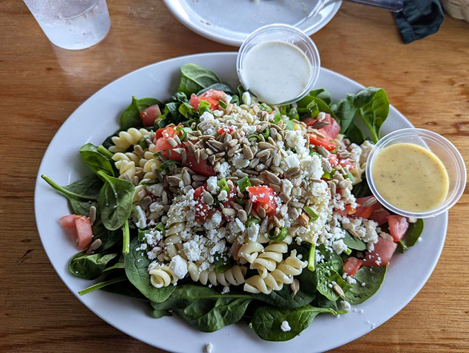 A pasta salad that doesn't know it's supposed to be boring—instead, it's showing off with fresh vegetables, feta, and enough color to brighten your day.