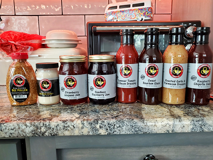 Mason jars filled with homemade goodness line up like edible soldiers. Strawberry jam and blackberry preserves&mdash;the sweet taste of someone's grandmother's recipe.