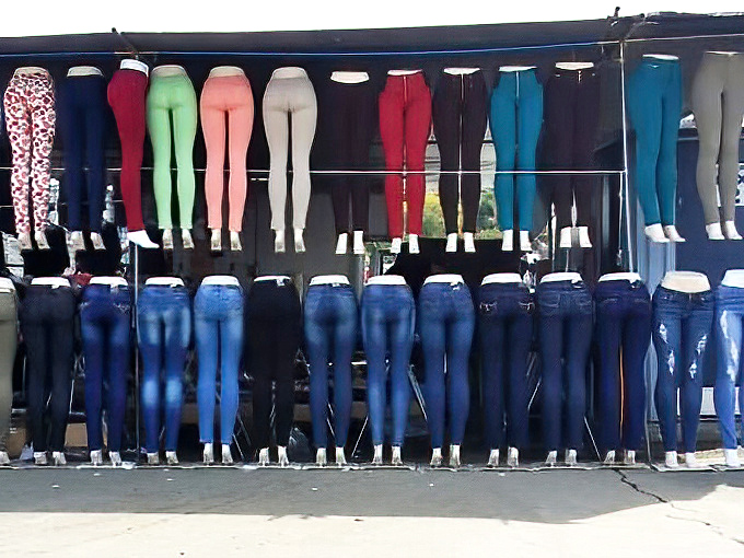 The leggings and jeans display forms a colorful chorus line of fashion possibilities. Your next favorite pants are hiding somewhere in this rainbow.
