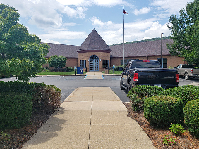 The Joseph & Elizabeth Shaw Public Library welcomes knowledge-seekers with its distinctive turret entrance. Books and community find their perfect home under this welcoming roof.
