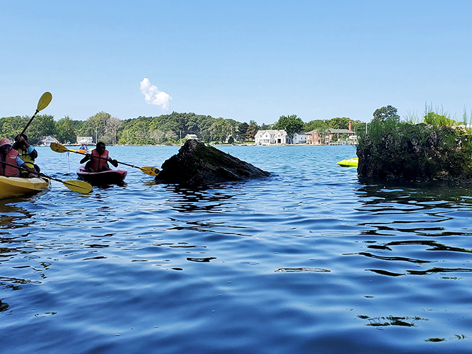 Kayaking these waters feels like gliding across liquid glass. The rocky outcroppings create natural obstacle courses for paddlers seeking gentle adventure.
