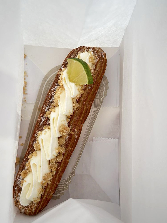 Key lime &eacute;clair looking like a tiny green torpedo of happiness &ndash; Florida vacation in pastry form.