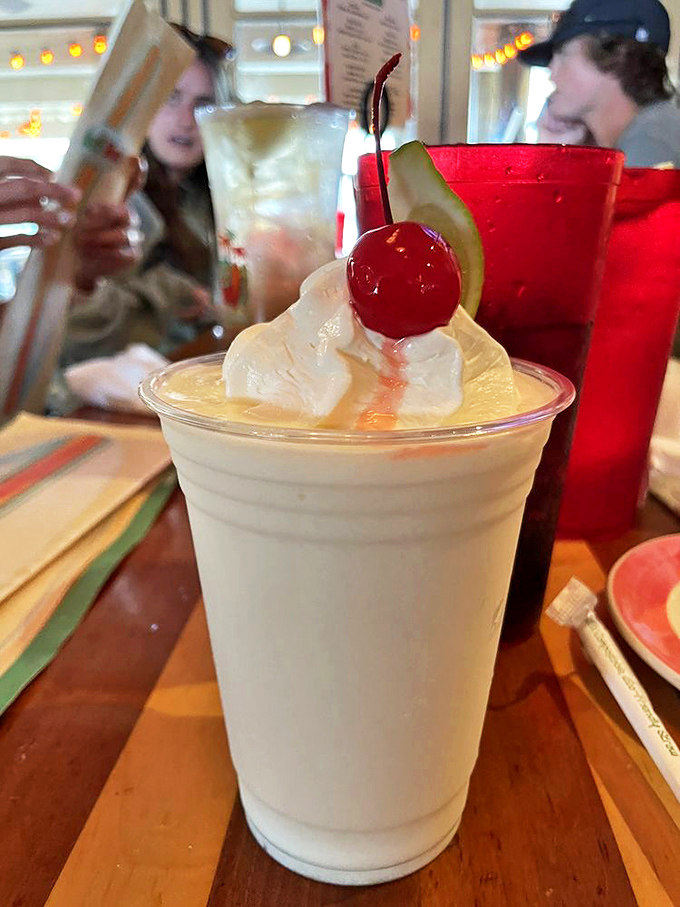 The Key Lime Freeze arrives like a celebrity, complete with cherry on top. Dessert and digestif in one frosty package.