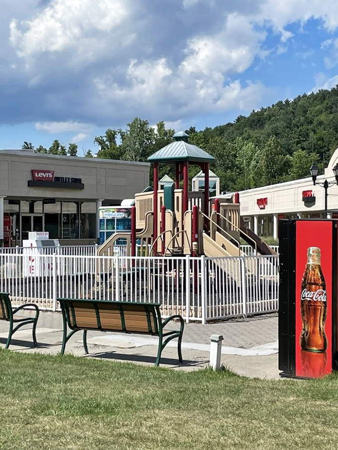 Clever designers included this playground oasis where kids can burn energy while parents debate whether they really need another pair of discounted sneakers.