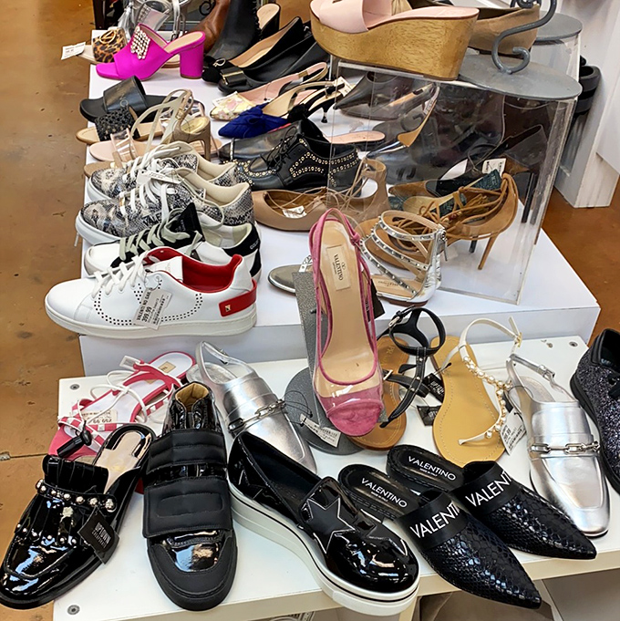 A shoe display that proves Cinderella could have had multiple glass slippers and still afforded rent. Valentino flats for the price of brunch!