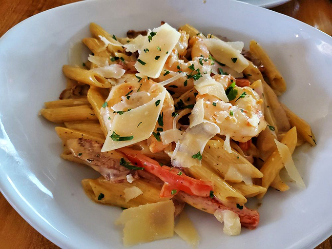 Pasta Lafayette—where shrimp and parmesan flakes play together like old friends at a delicious reunion party.