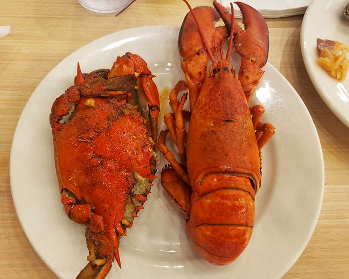 The ocean's odd couple: a whole Maine lobster alongside a blue crab, like Neptune's version of a perfect surf and turf.