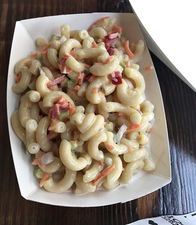 Even the macaroni salad gets the gourmet treatment here, proving no side dish goes unnoticed or unloved.