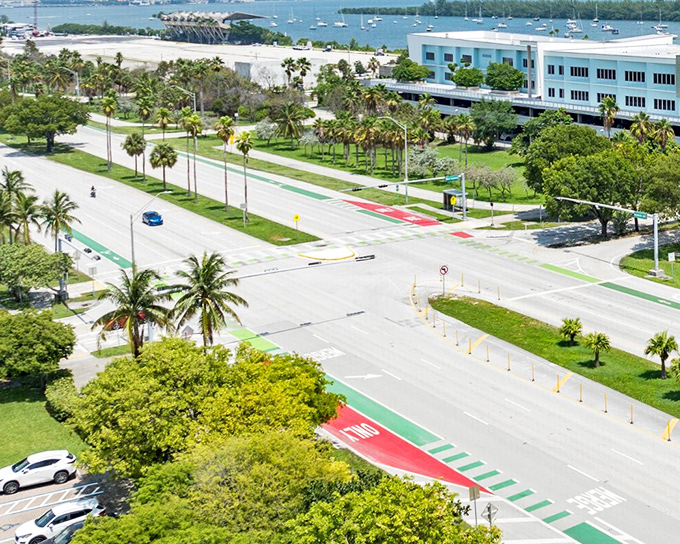 Key Biscayne's roadways burst with tropical color, where even traffic intersections get the paradise treatment with palm-lined medians.