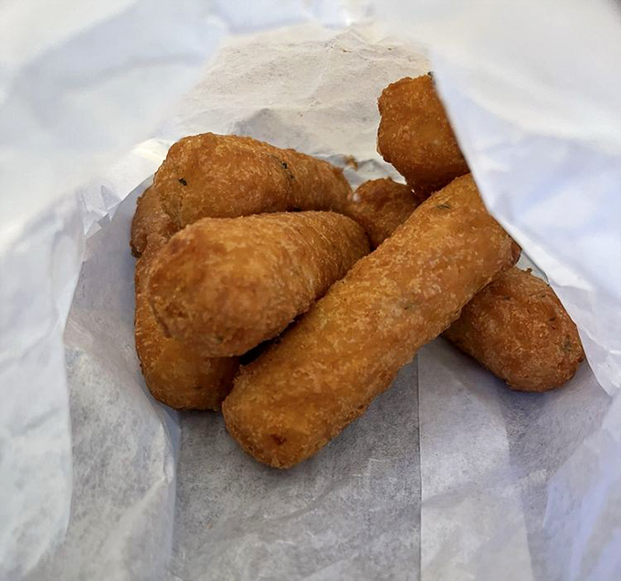 Golden-fried mozzarella sticks: the supporting actors that sometimes steal the scene. Crispy exterior, molten interior&mdash;a textbook example of fried perfection.