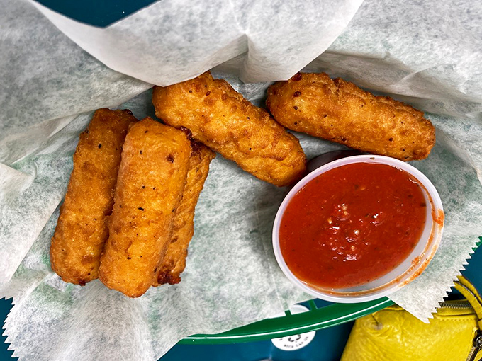 Golden-fried mozzarella sticks with marinara&mdash;the perfect opening act before the main event. Crispy outside, stretchy inside, happiness all around.