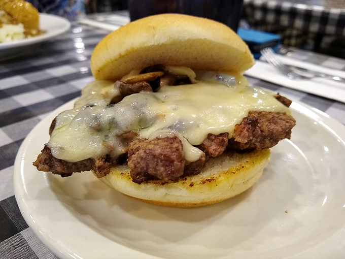 Melted Swiss cheese blankets this burger like a cozy sweater, while mushrooms add that earthy flavor that makes everything better.