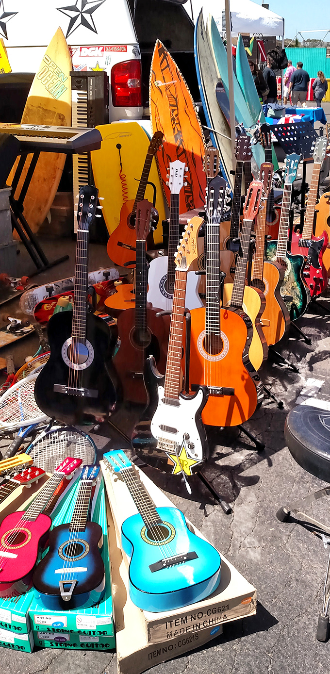 The musician's corner &ndash; where guitars of every color await their next serenade, alongside surfboards ready for their next wave.