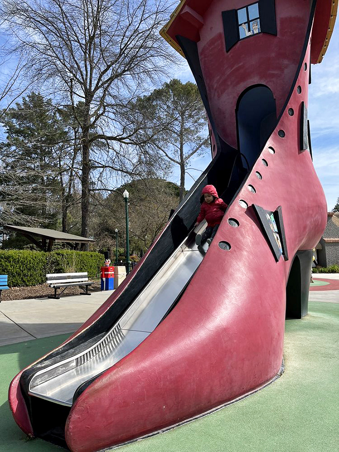 The Old Woman's Shoe slide proves that impractical footwear can be fun. Architectural whimsy that would make Dr. Seuss proud!