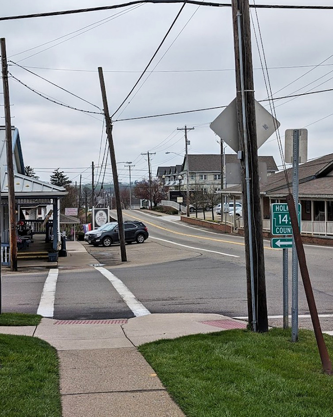 At this crossroads, time seems to pause between centuries – power lines overhead, horse-drawn buggies still welcome.