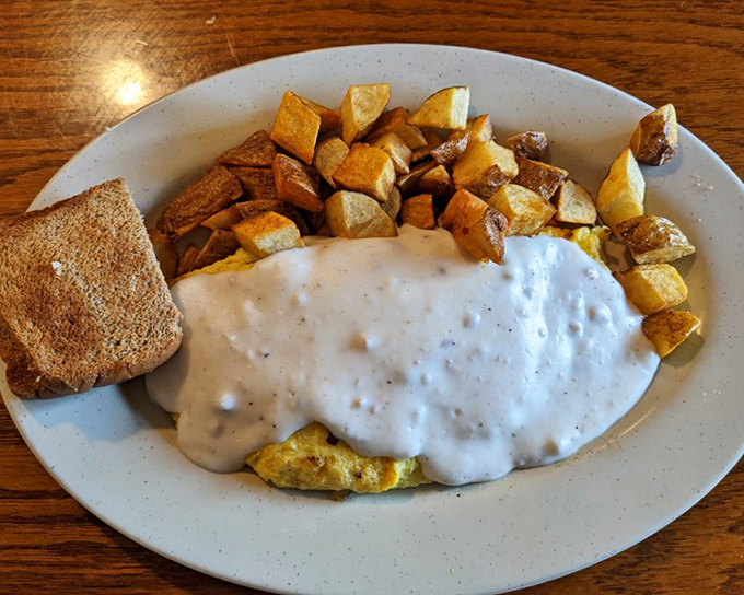 Breakfast nirvana: a country skillet smothered in creamy gravy with eggs on top&mdash;the kind of dish that makes you want to hug the cook.