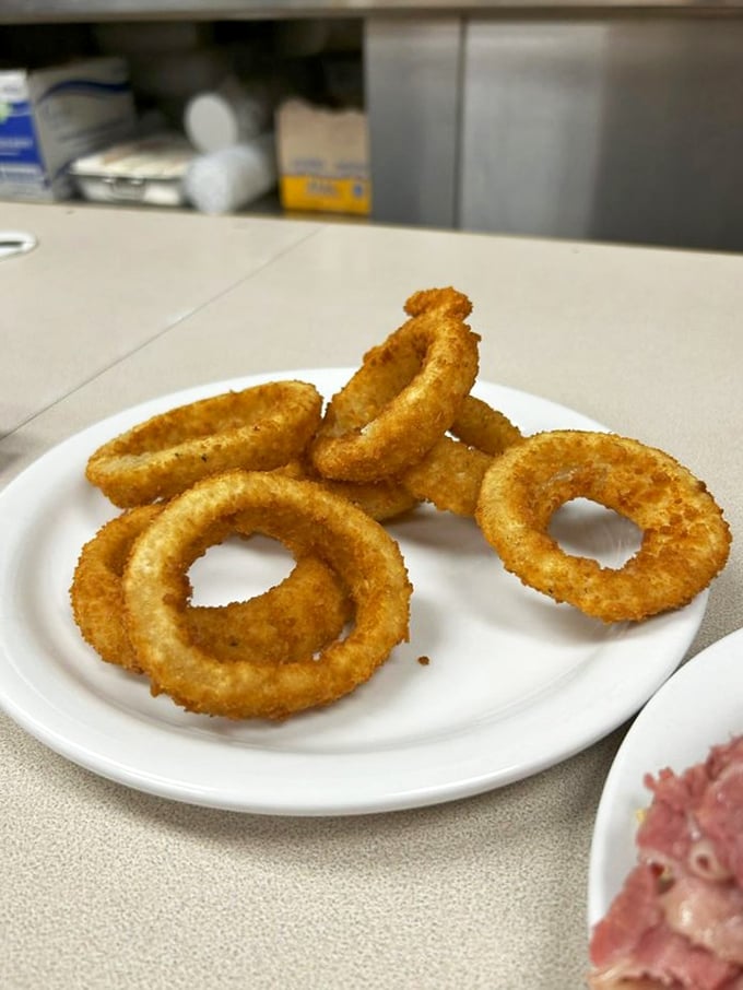 These aren't just onion rings; they're halos of happiness. Perfectly golden, audibly crunchy, and worth every moment of onion breath that follows.