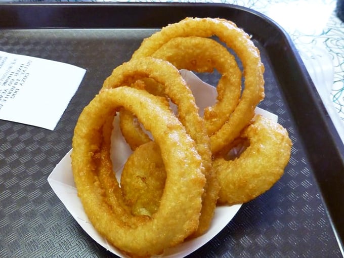 Onion rings with architectural integrity that would make Frank Lloyd Wright proud&mdash;crispy, substantial, and engineered for maximum flavor delivery.