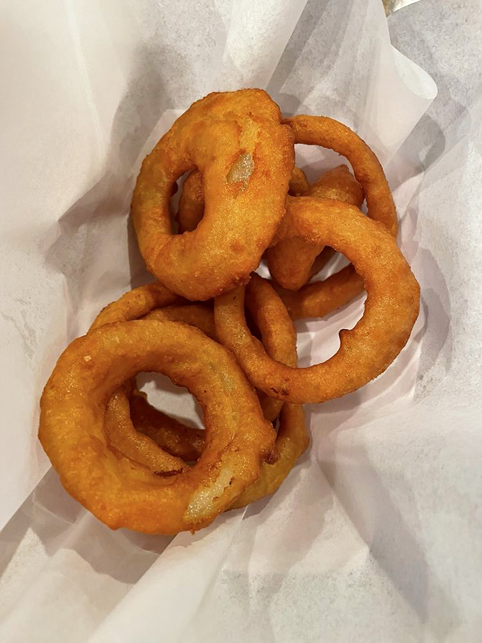 Beer-battered onion rings with that perfect pull&mdash;where the onion stays put until you want it to surrender. A textbook example of fried excellence.