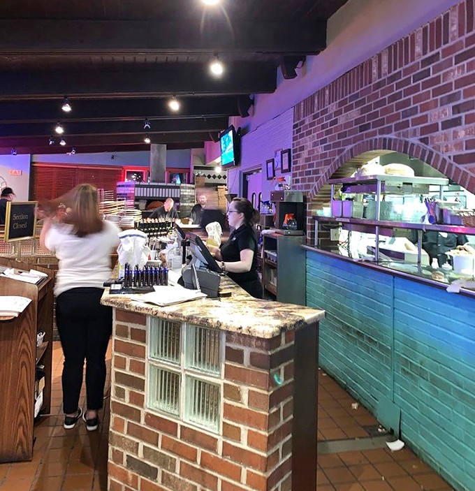 Where pizza dreams begin their journey to reality. The open kitchen design means dinner and a show come standard with every order.