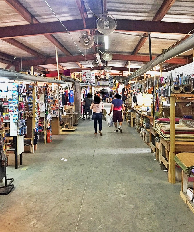 The indoor market's wide aisles invite exploration, with each booth offering its own universe of possibilities and peculiarities.