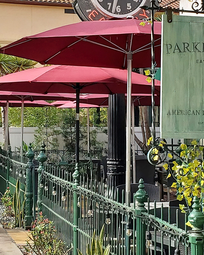 The patio's pink umbrellas create the perfect microclimate for mimosa consumption and pretending you don't have afternoon meetings.