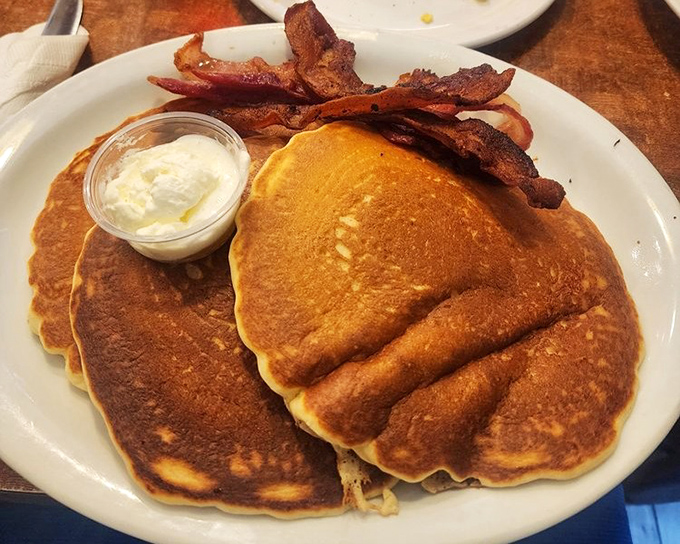 Golden pancakes with a side of perfectly crisped bacon&mdash;the breakfast equivalent of winning the lottery before you've had your coffee.