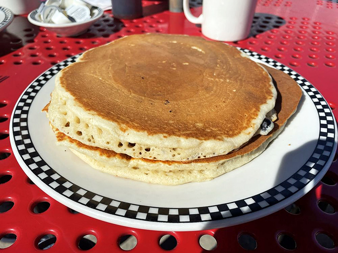 These aren't just pancakes; they're golden discs of happiness that make you wonder why brunch became trendy when breakfast was perfect all along.