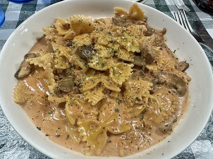 Pasta that's swimming in a sauce so rich it probably has its own accountant. Those mushrooms aren't just along for the ride; they're driving.