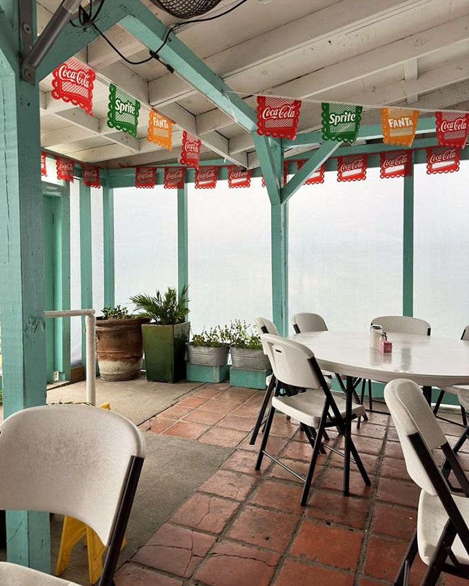 The patio's papel picado-inspired soda banners flutter overhead like festive flags, turning a simple outdoor meal into something that feels like a celebration.