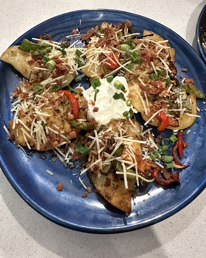 Not your grandmother's perogies (unless she was a culinary genius). These pillowy pockets topped with bacon, cheese, and green onions redefine comfort food.