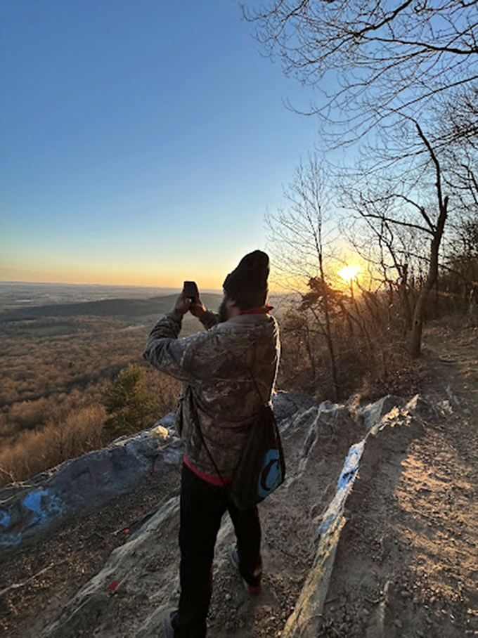 Finding your perfect perch at sunset &ndash; because some moments deserve a rocky throne.