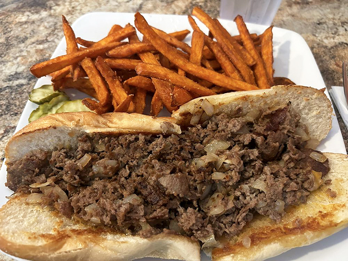 A proper cheesesteak with a mountain of seasoned meat and those golden fries&mdash;the kind of lunch that necessitates loosening your belt afterward.