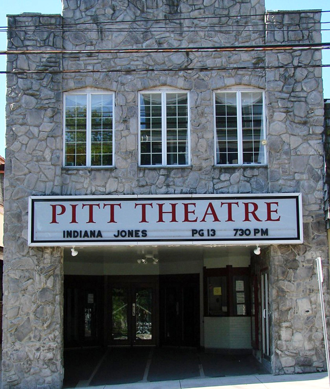 The Pitt Theatre's stone facade promises entertainment that beats scrolling through Netflix for the hundredth time tonight.