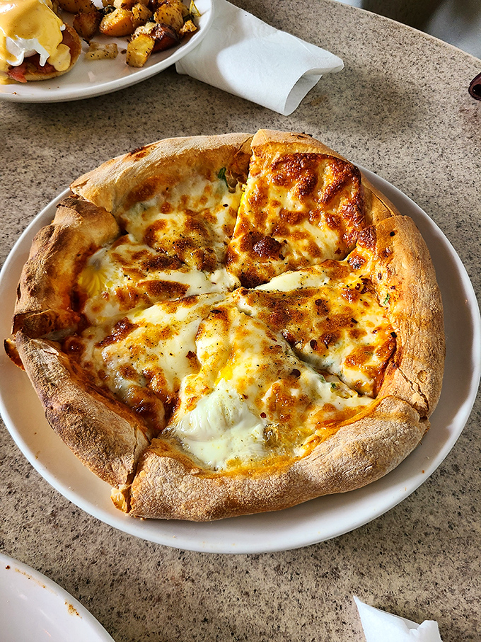 Pizza with a crust that's part cloud, part bread. The cheese pulls would make an Italian grandmother weep with pride.