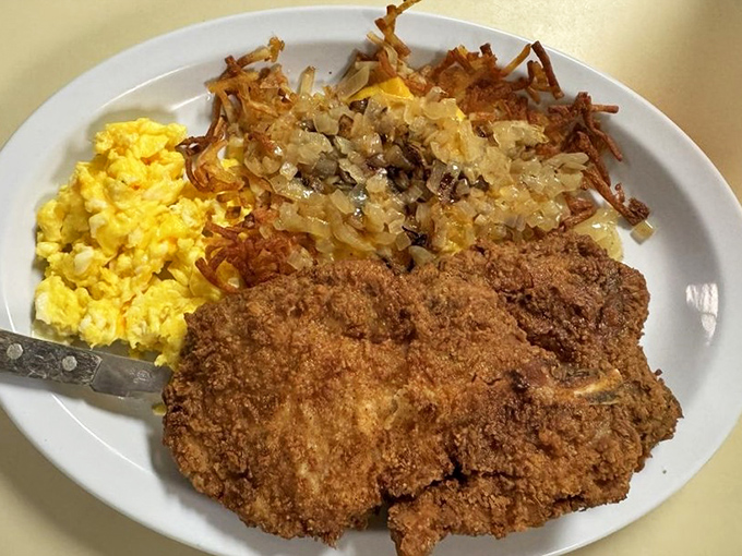 Country-fried pork chops with hash browns and eggs&mdash;the breakfast equivalent of a warm hug from someone who really knows how to cook.