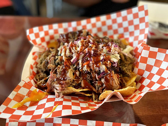 Pulled pork nachos that transform bar food into something worthy of a standing ovation.