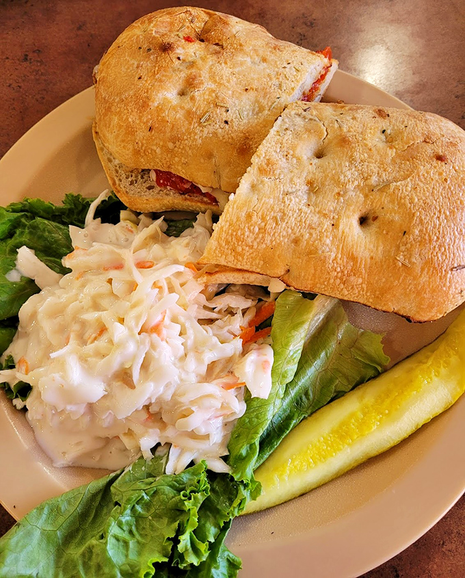 A sandwich that requires both hands and several napkins&mdash;the universal signal for "worth every messy bite." That coleslaw side act isn't just phoning it in either.