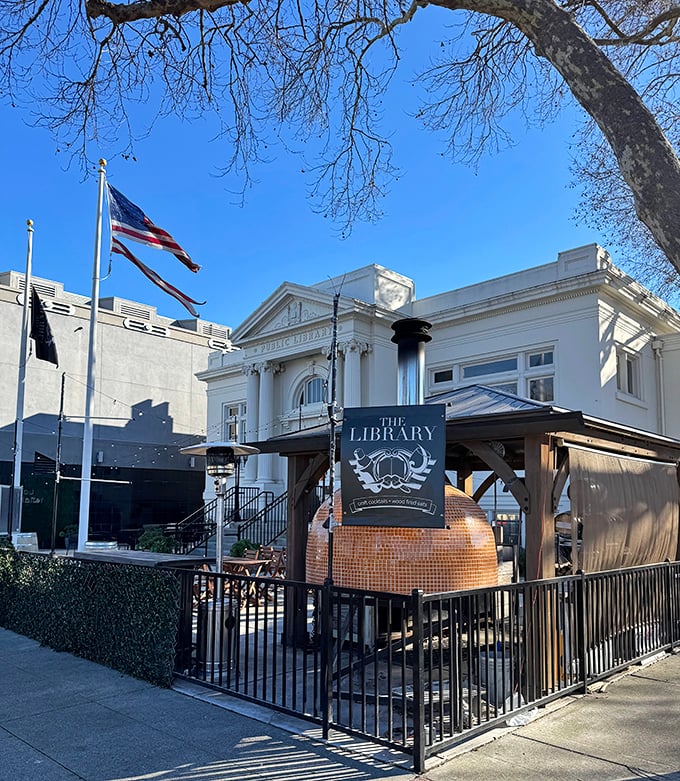 The public library combines classical architecture with a quirky outdoor pizza oven – because nothing pairs with a good book like fresh-baked bread.