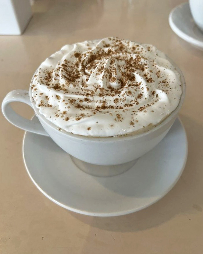 This isn't just coffee with whipped cream; it's a warm hug in a cup. The cinnamon dusting on top is the culinary equivalent of a friendly wink.