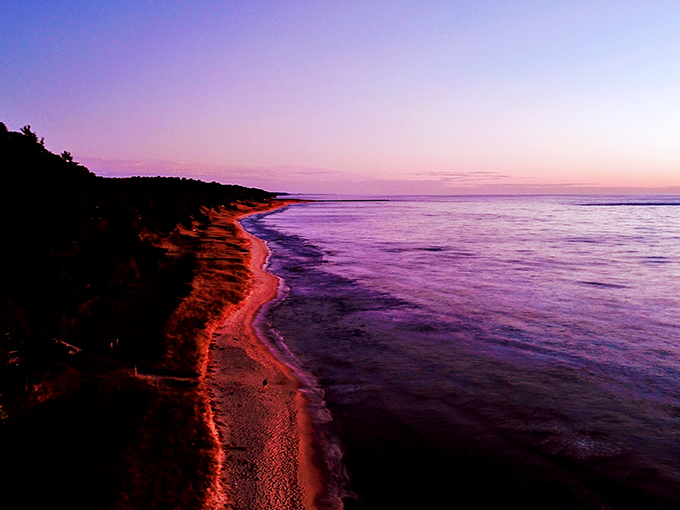 Twilight transforms Lake Michigan into a purple dreamscape, proving that sometimes the best show in town doesn't require tickets.