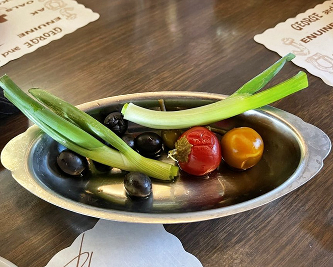 The relish tray&mdash;a dying art form worth preserving. Those pickled vegetables aren't just appetizers; they're palate awakeners preparing you for the main event.