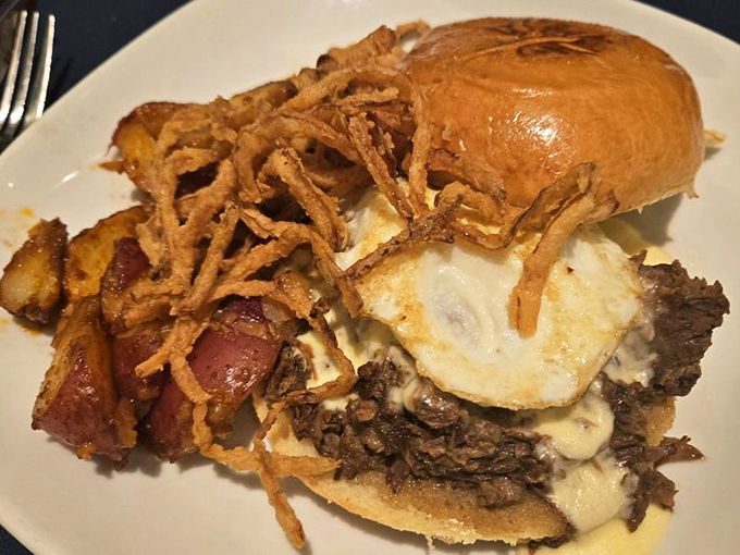 A rib sandwich that doesn&rsquo;t just satisfy hunger&mdash;it obliterates it. Those crispy onion strings are the crown jewels of comfort food.