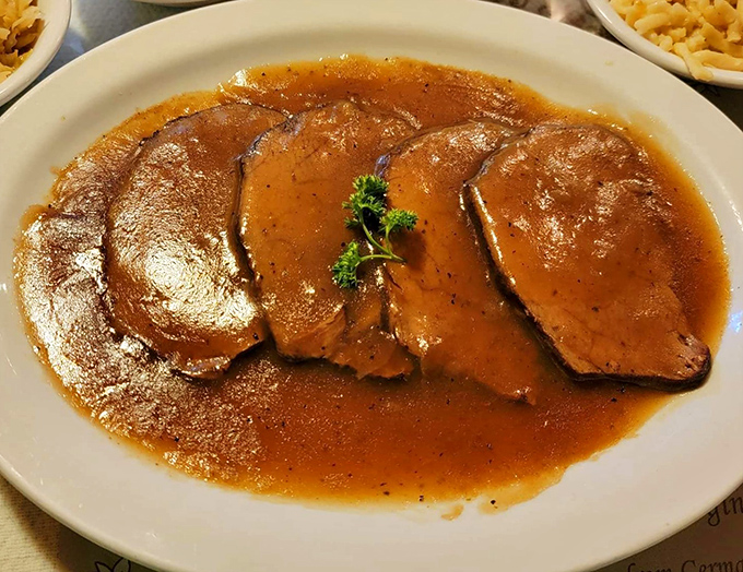 Sauerbraten that's been marinating longer than some Hollywood marriages last, tender enough to cut with a stern glance.