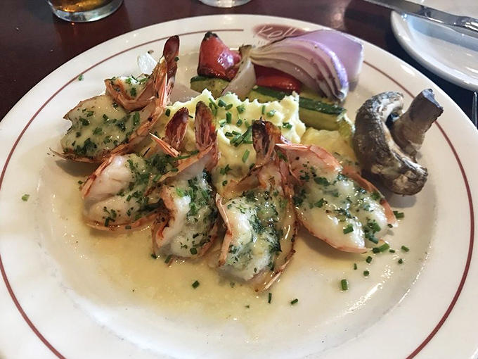 These prawns aren't just cooked&mdash;they're pampered in garlic butter until they surrender all their sweet oceanic flavor, accompanied by grilled vegetables that know their supporting role.