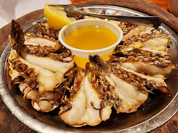 Rock shrimp broiled to butterflied perfection, ready to make your taste buds do a happy dance.