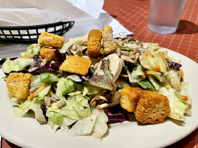 Even the salad knows its in meat country&mdash;crisp, fresh, and adorned with croutons like little flavor lifeguards ready to rescue you from vegetable boredom.