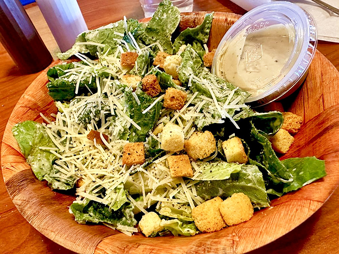 A Caesar salad that doesn't apologize for being healthy – crisp romaine, generous cheese, and croutons that actually crunch when you bite them.