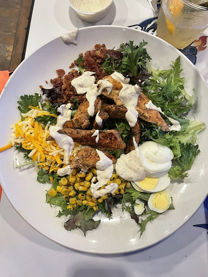 This isn't just a salad; it's a strategic assembly of textures and flavors where grilled chicken and fresh greens negotiate a delicious peace treaty. 