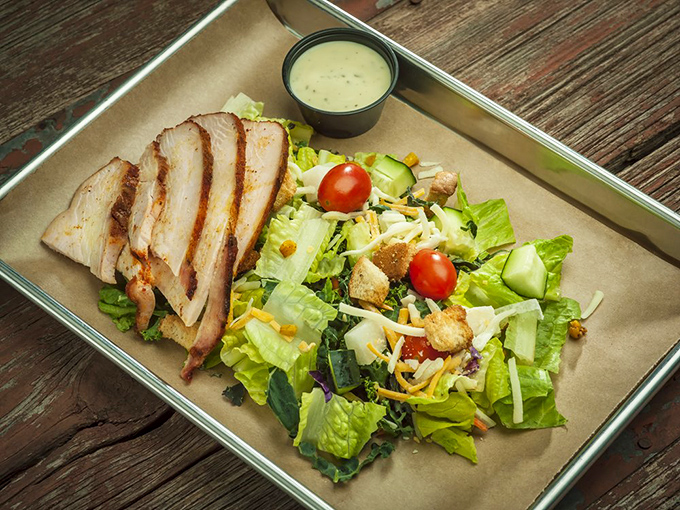 Even the salad gets the barbecue treatment. Fresh greens playing nice with smoky chicken&mdash;proof that healthy choices and flavor can coexist.